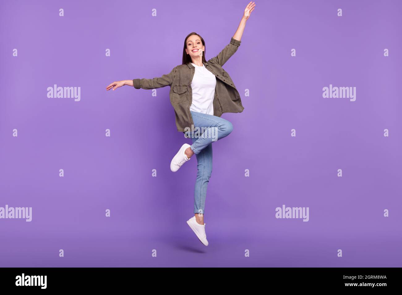 Full length body size photo smiling woman jumping up gracefully ...