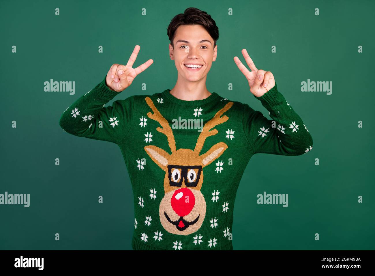 Photo of positive friendly show two v-signs wear deer ornament sweater ...