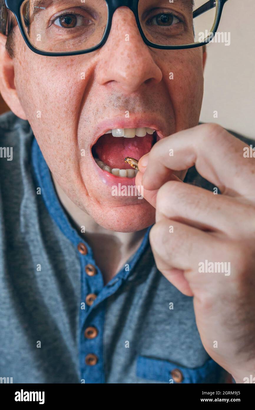 Human eating insect hi-res stock photography and images - Alamy