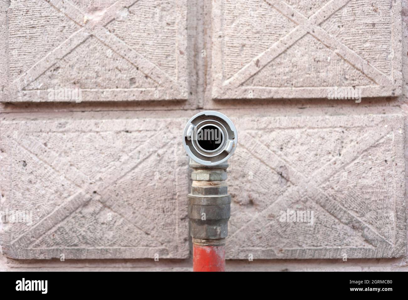Firefighter fire fountain by the wall Stock Photo - Alamy