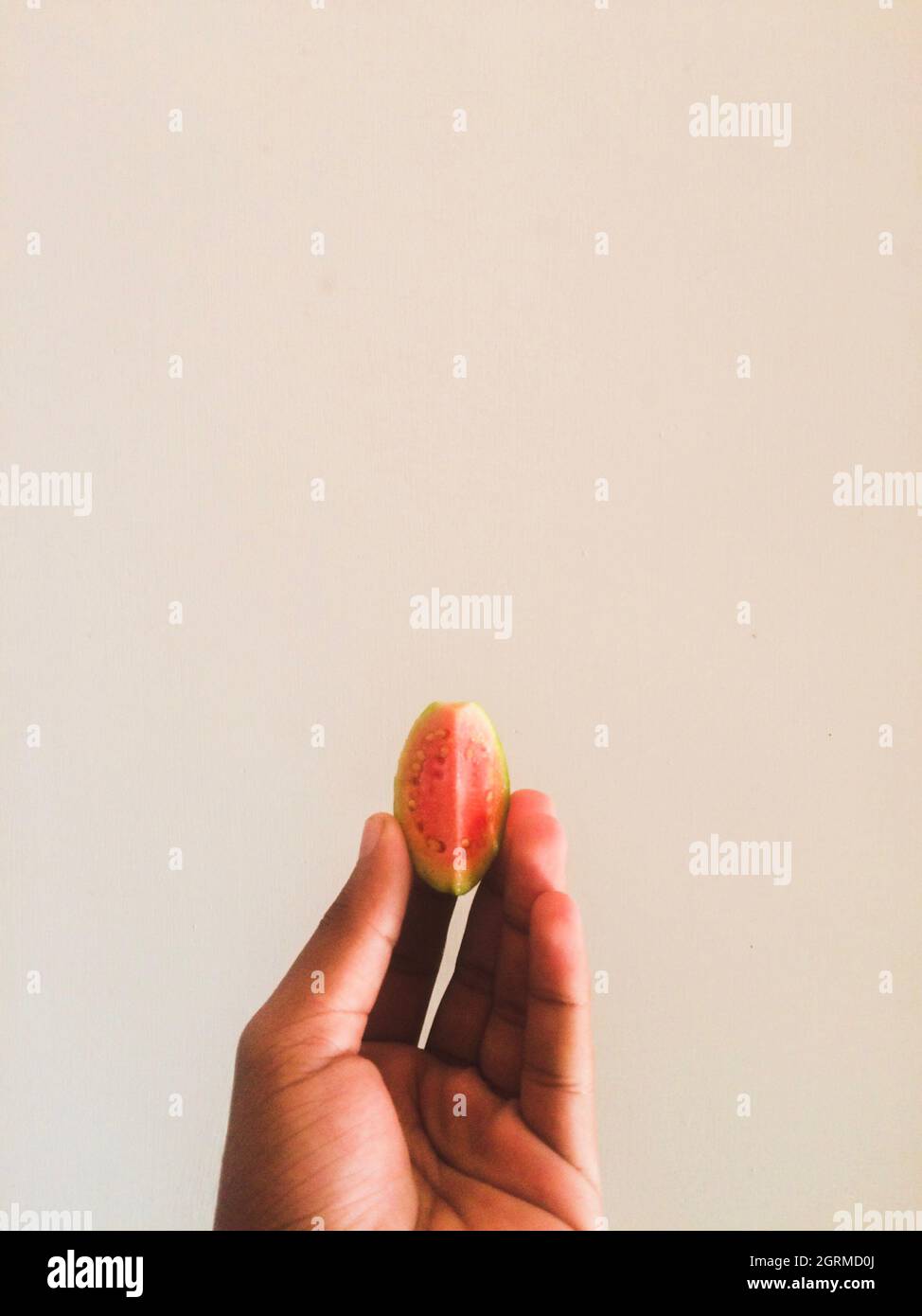 Human hand with guava hi-res stock photography and images - Alamy