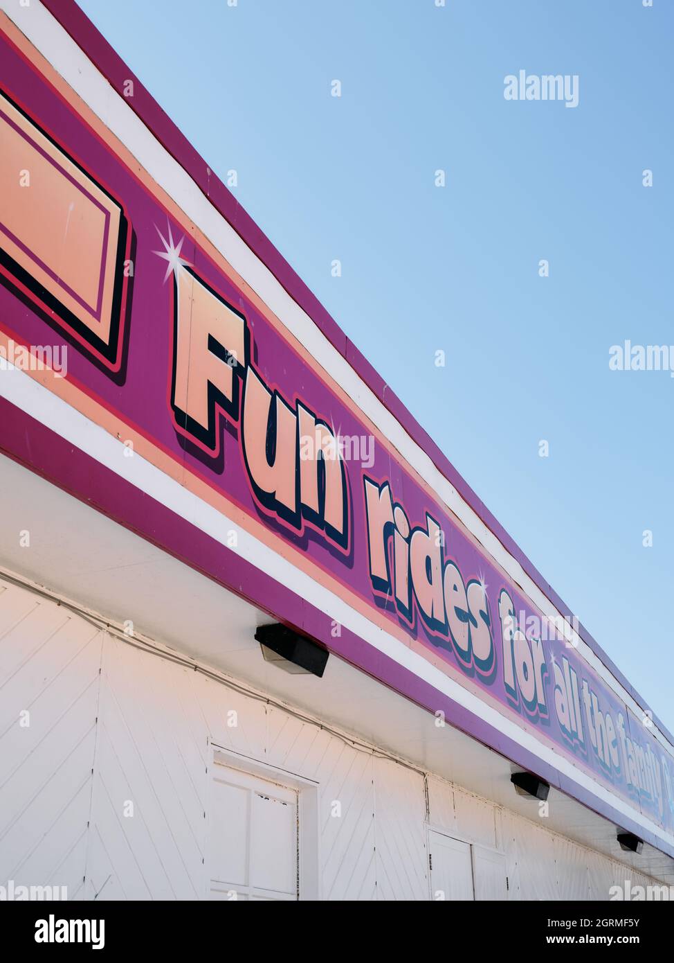 Fun rides sign writing on the amusement arcade pier in Great Yarmouth ...