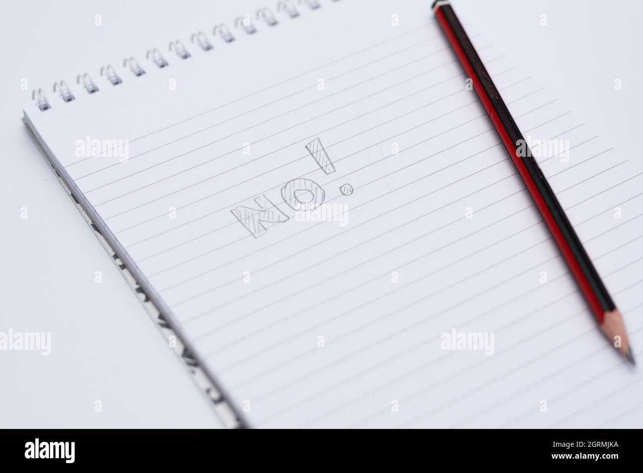 Notepad and pencil with NO! written in capital letters Stock Photo - Alamy