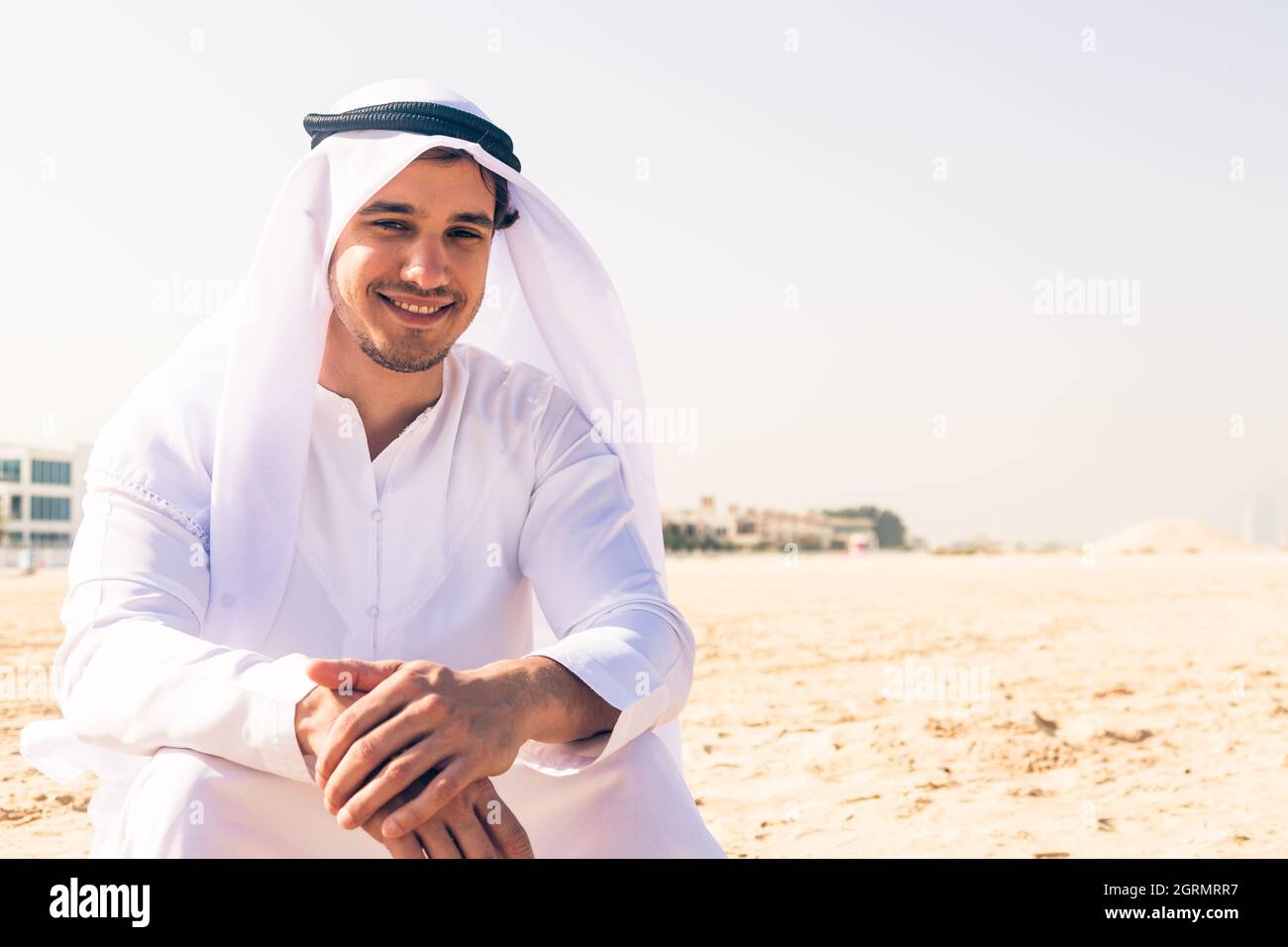 Portrait Of Man In Dish Dash At Beach During Sunny Day Stock Photo - Alamy
