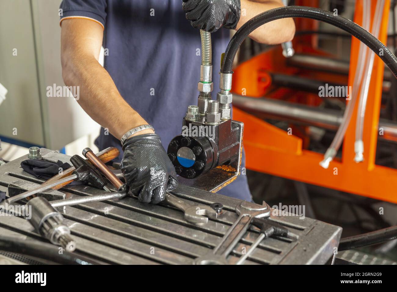 hydraulic repair pumps in the workshop Stock Photo - Alamy