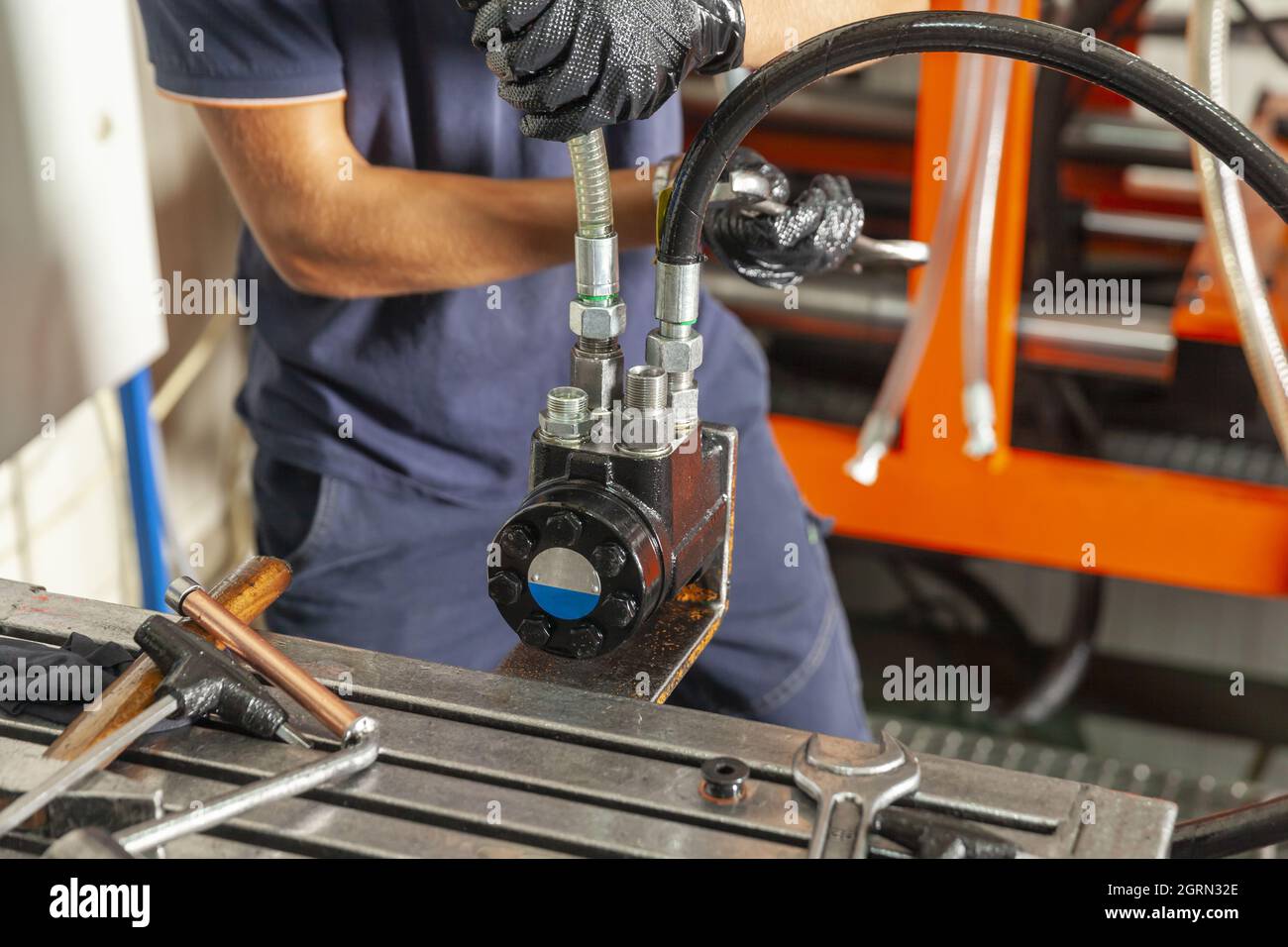 hydraulic repair pumps in the workshop Stock Photo - Alamy