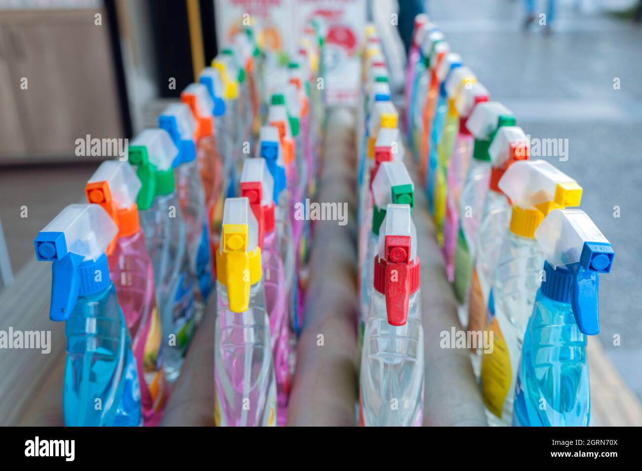 Spray boxes lined up in order Stock Photo - Alamy