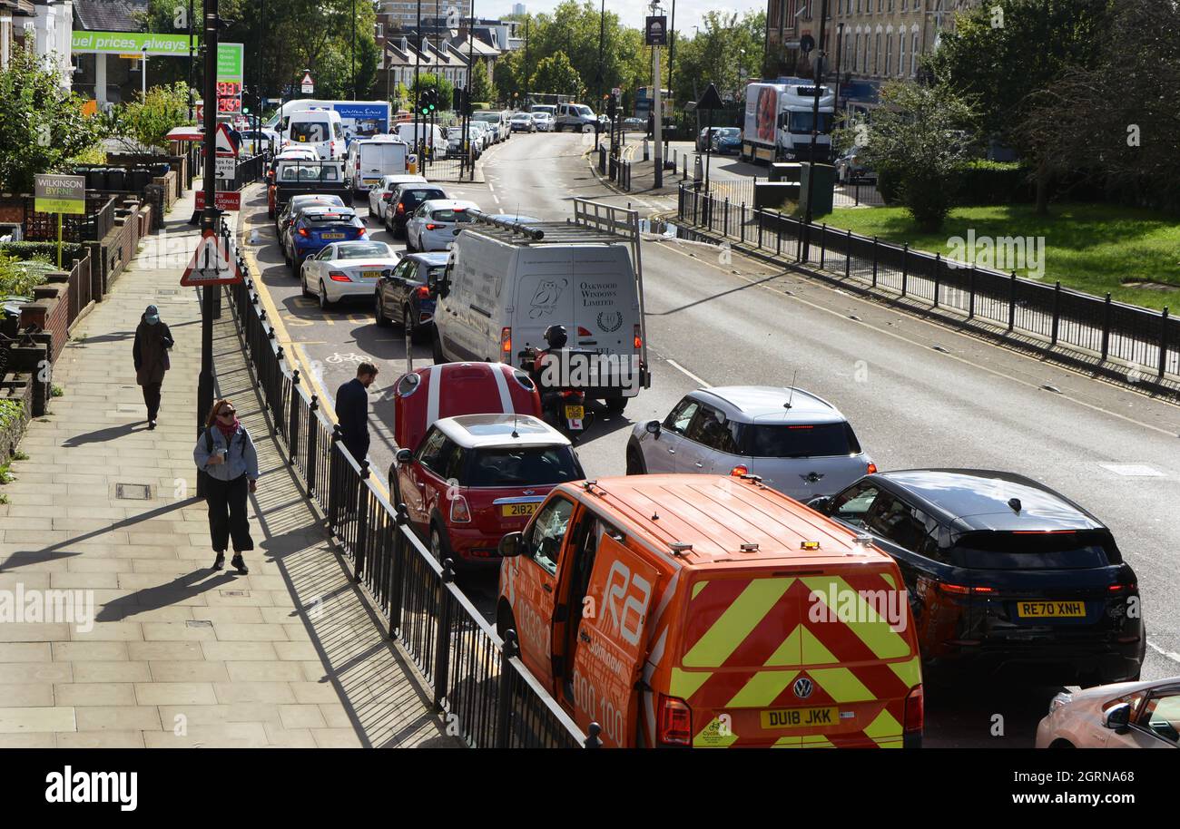 Queues of traffic block the road in both directions as drivers wait ...