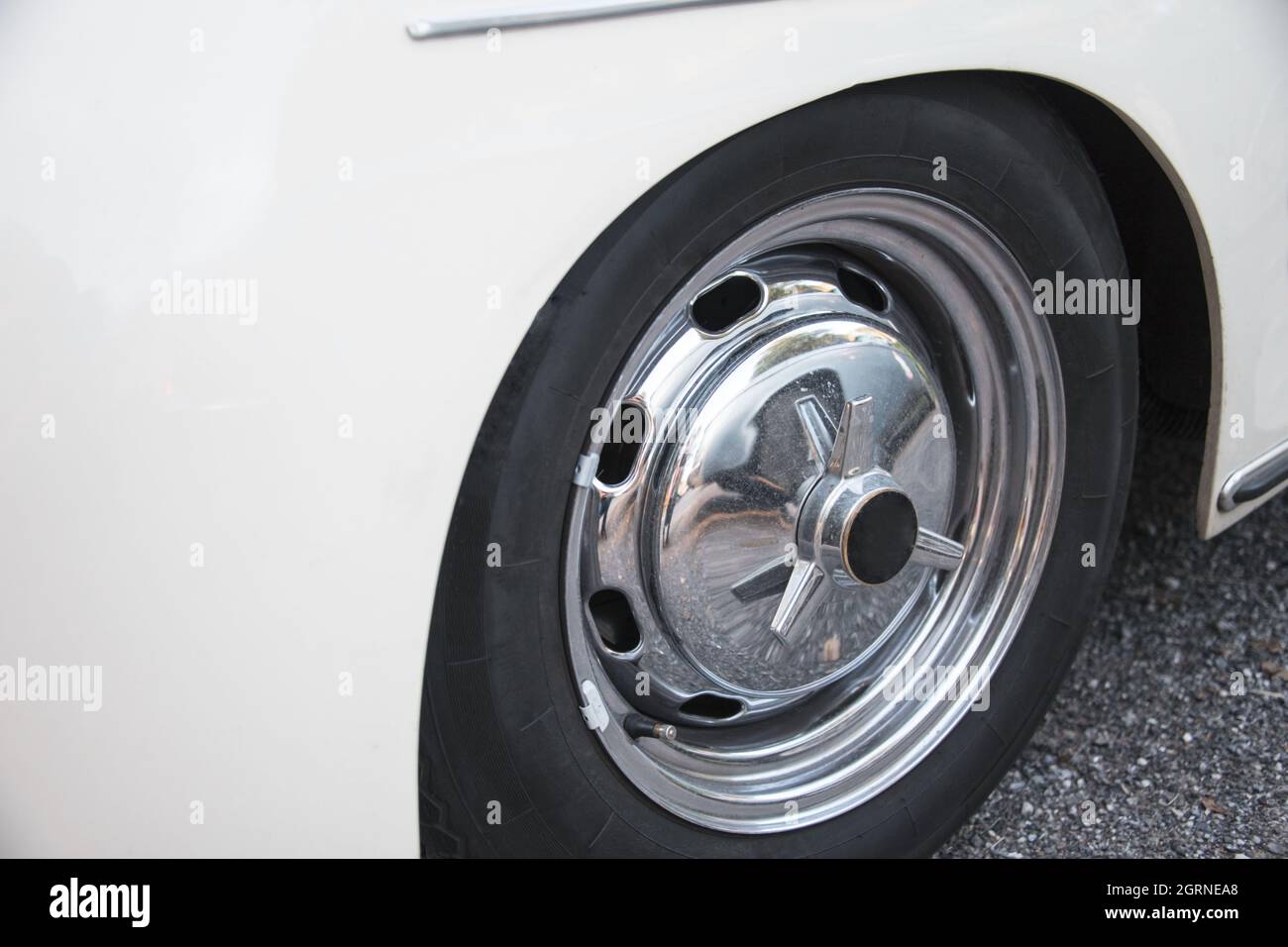 closeup partial view of white vintage car with alloy rim and tyre Stock ...