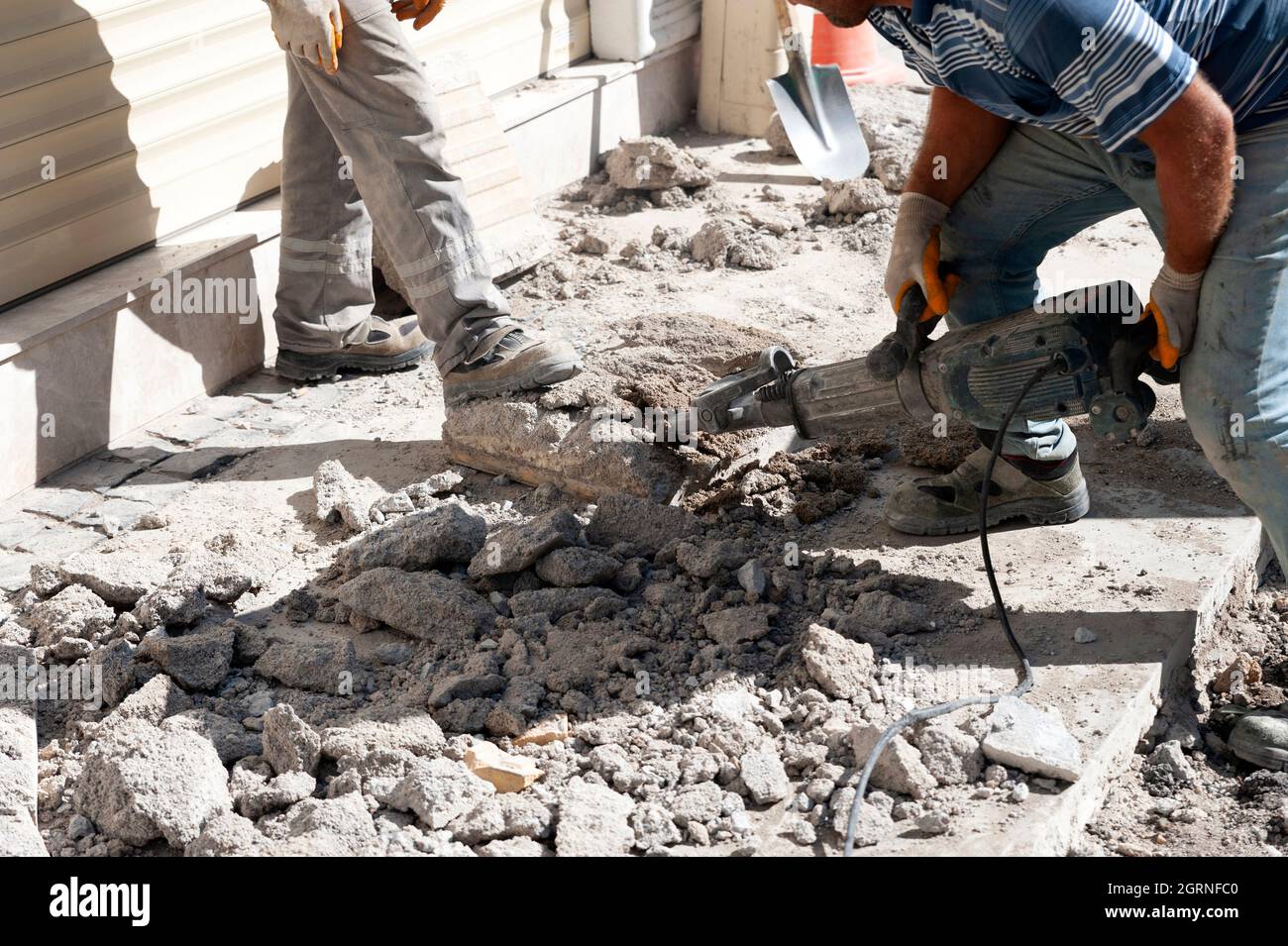 The sidewalk workers are working Stock Photo - Alamy