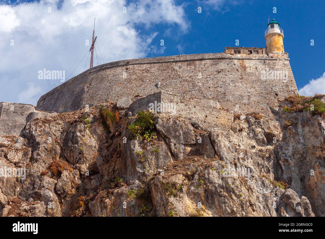 Old stone lighthouse on top of a cliff in the old fort. Kerkyra. Greece ...