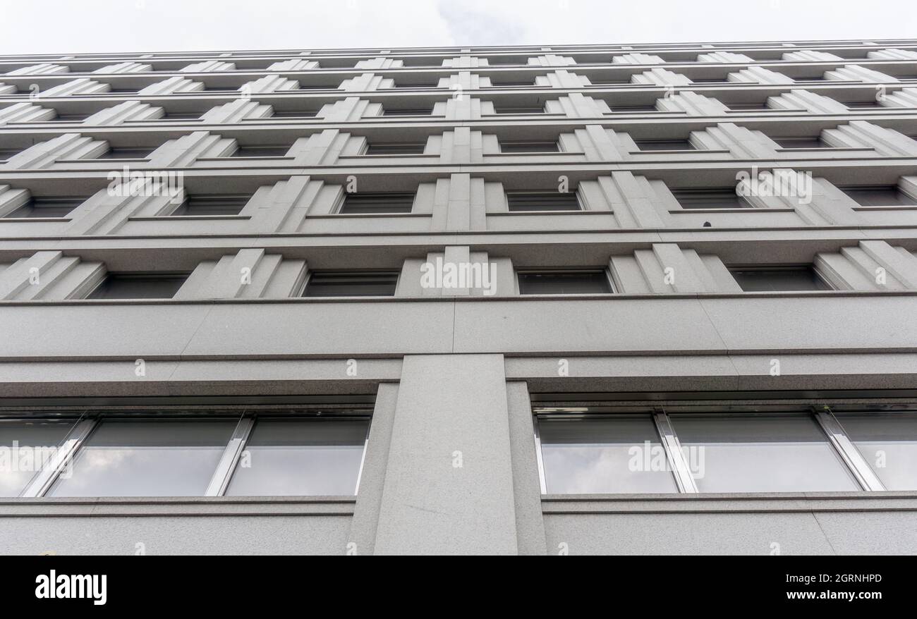 Exterior wall and windows in repeating pattern building rising from ...