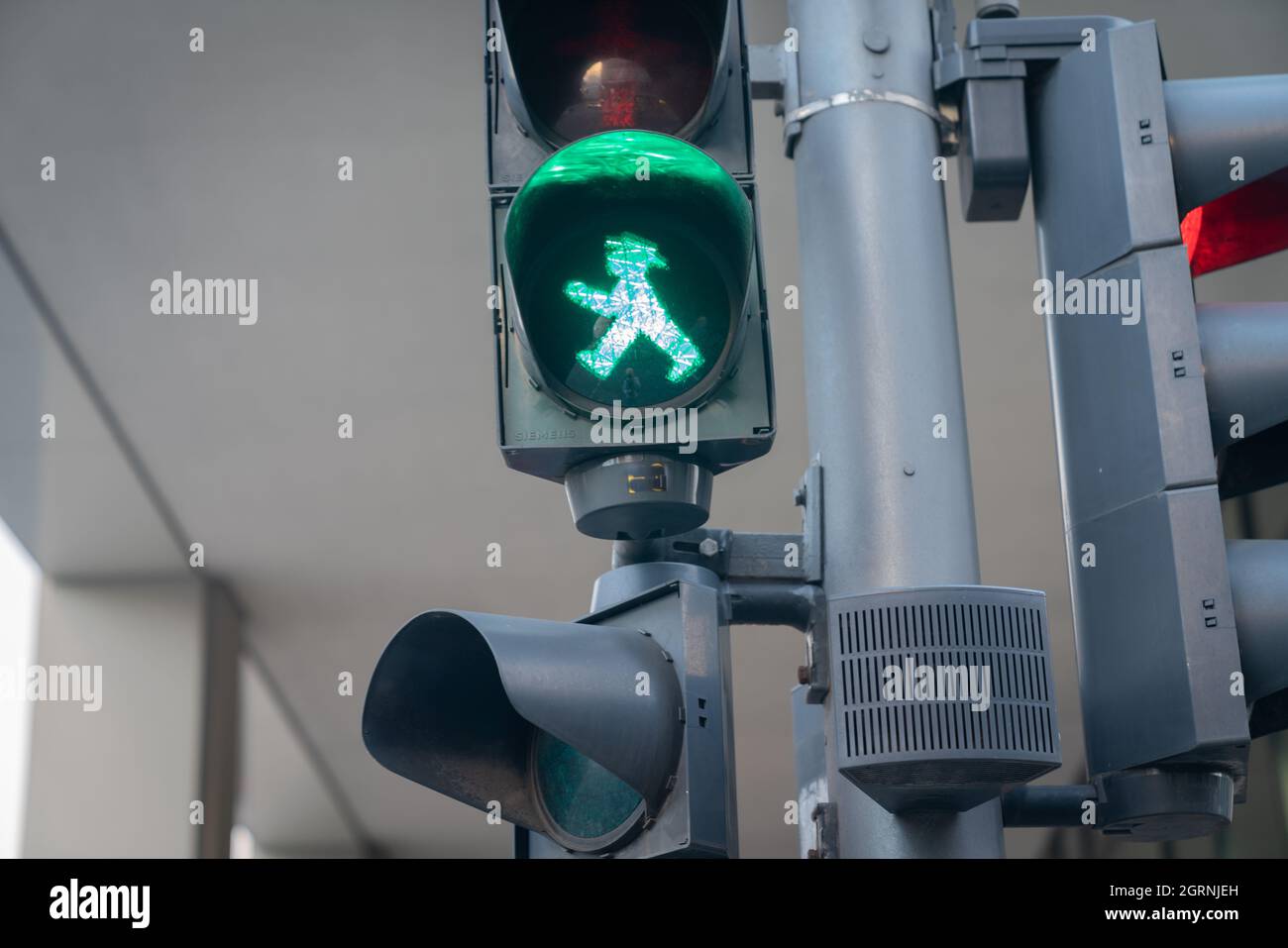 Green man walk now pedestrian light on street Stock Photo - Alamy