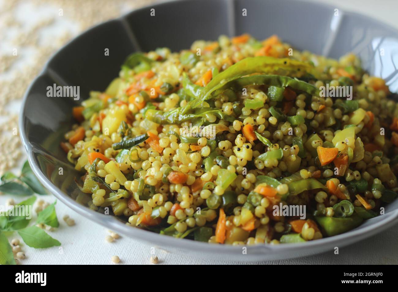 Sorghum upma. A South Indian breakfast dish with whole Sorghum and ...