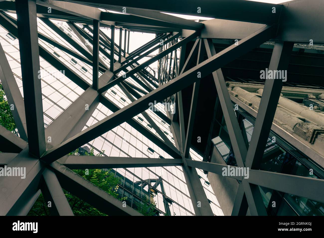 Heavy structural steel framing in supporting pattern rising from ground ...