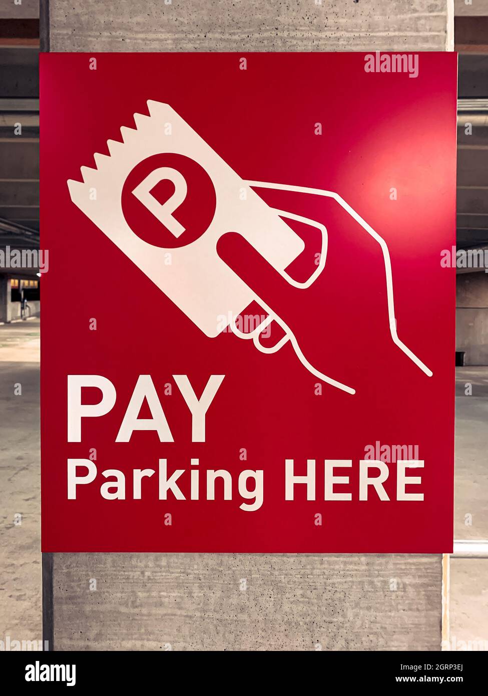 Vertical shot of a parking pay poster Stock Photo - Alamy