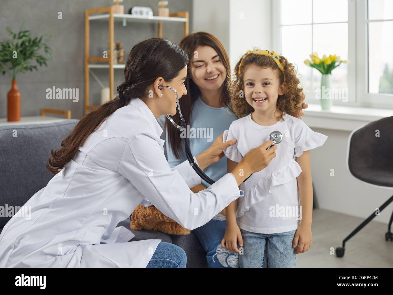 Girl listening heartbeat doctor stethoscope hi-res stock photography ...