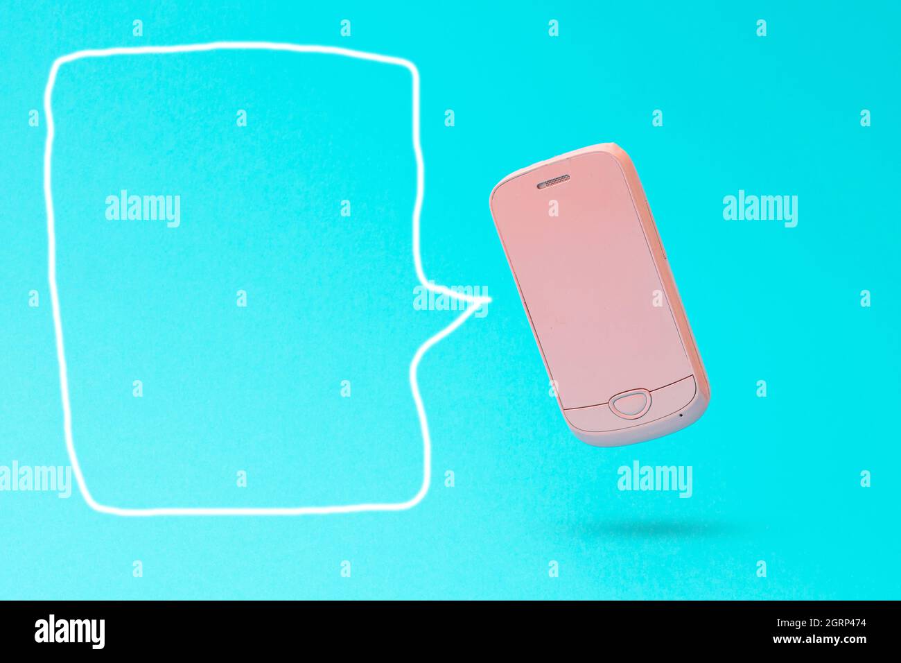 Blank speech bubble with pink 3d smartphone icon against blue ...