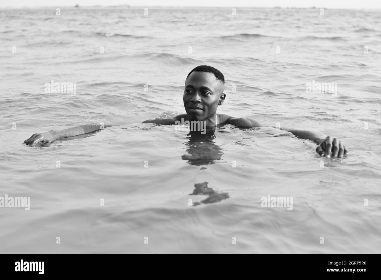 Boy swimming in the ocean Stock Photo - Alamy