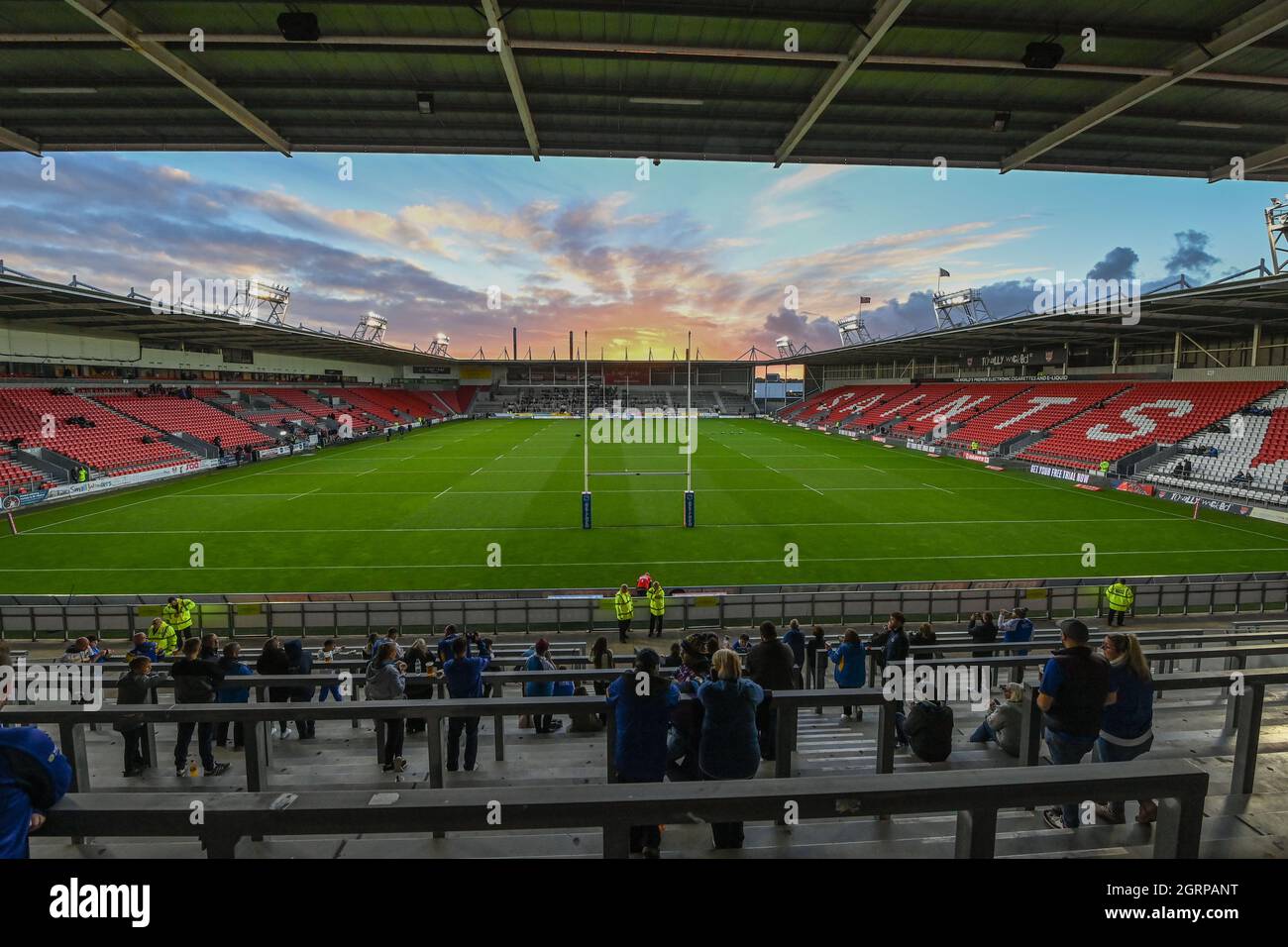 Fans arrive for this evening’s game as the sun sets behind the Totally ...