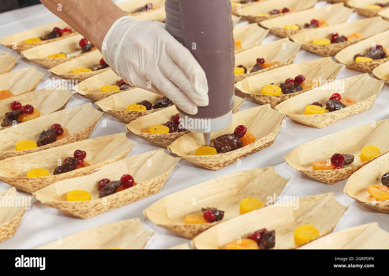 Cooking demonstration, table with food portions on display Stock Photo ...