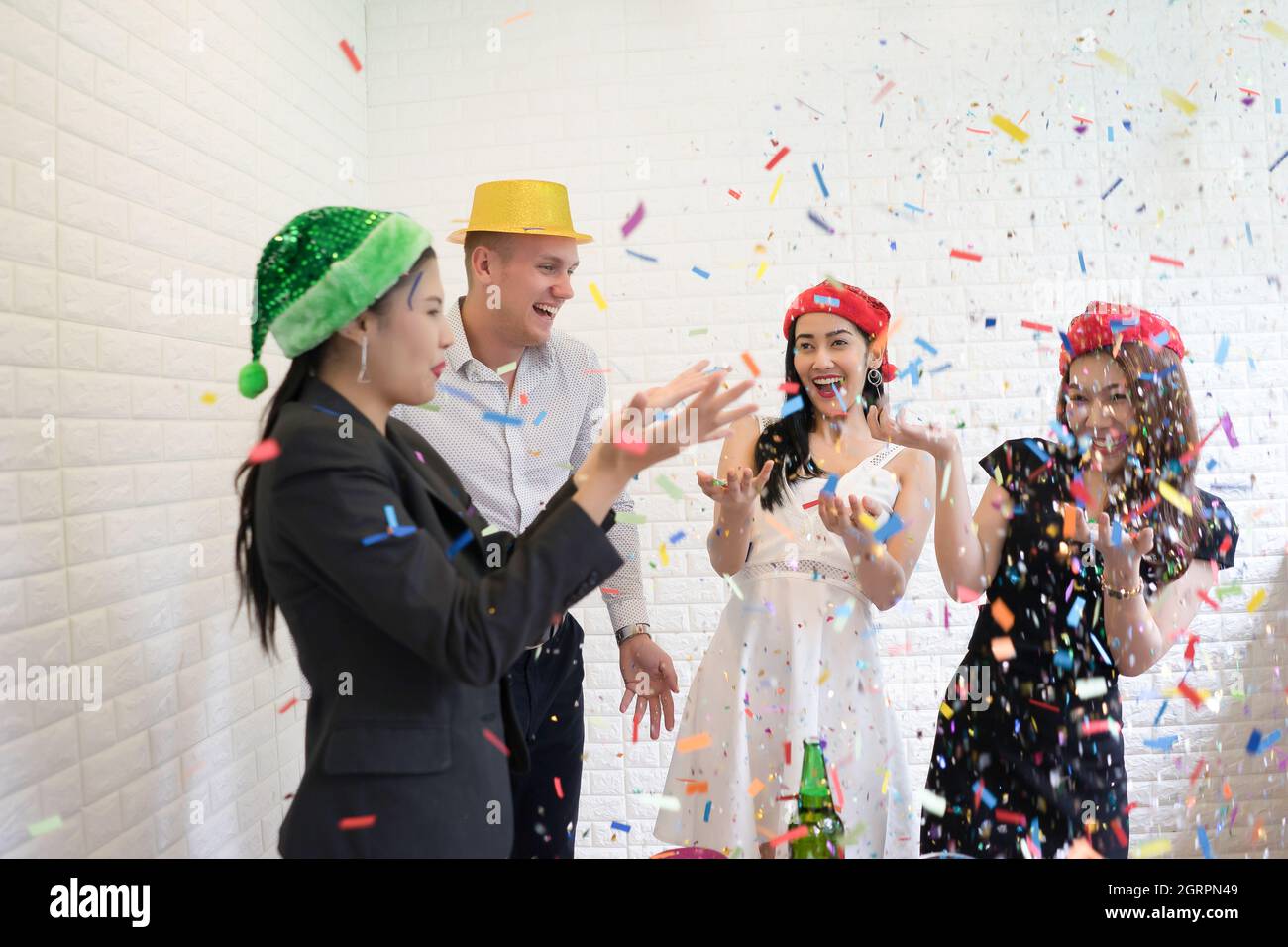 Four young friends against brick wall hi-res stock photography and ...