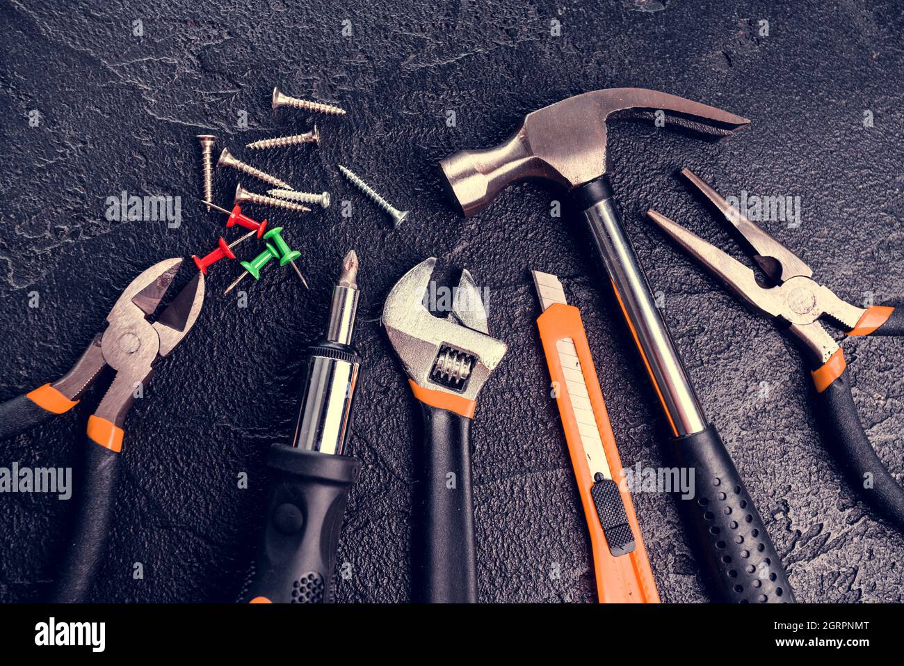 Tools for master builder on a black background Stock Photo - Alamy