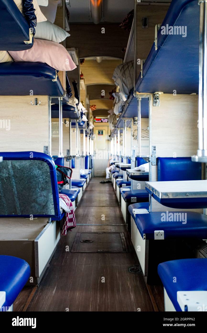 Interior of a typical russian long-distance RZD train with beds for ...