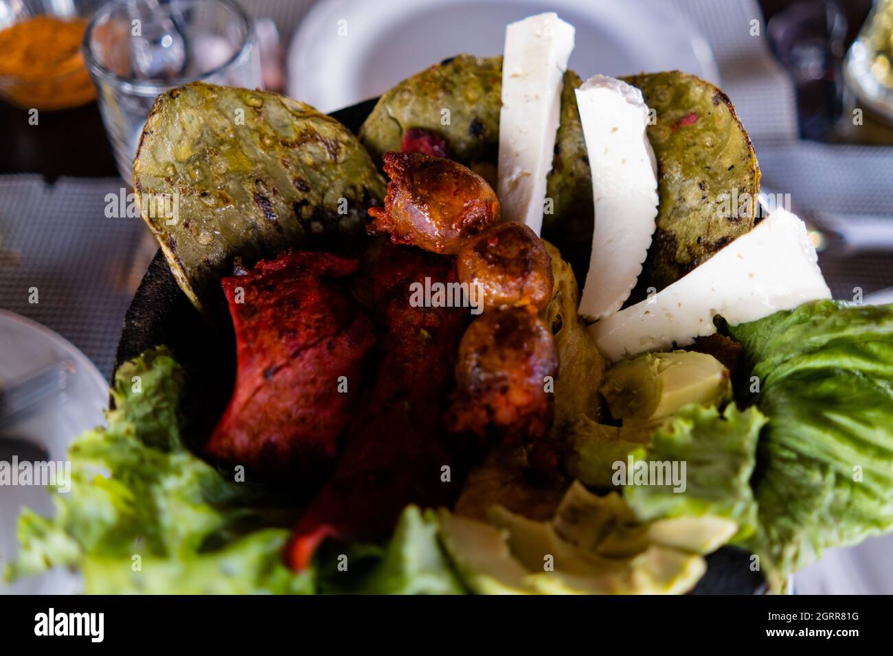 White cheese slices, lettuce, Mexican chorizo, and roasted nopales meal ...