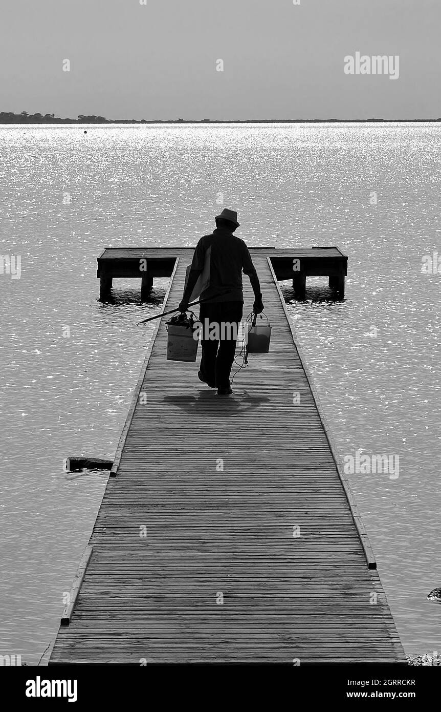 Men carrying buckets hi-res stock photography and images - Alamy