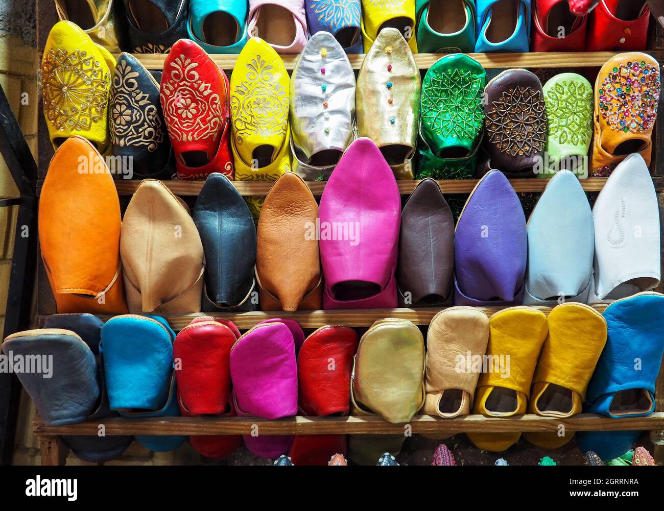 Handmade colourful leather slippers on display at traditional souk ...