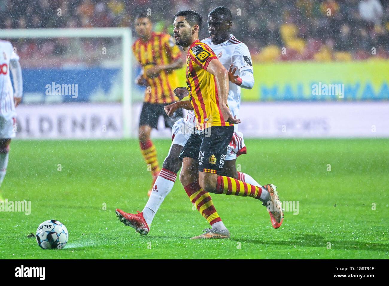 Mechelen's Sandy Walsh and Standard's Niels Nkounkou fight for the ball ...