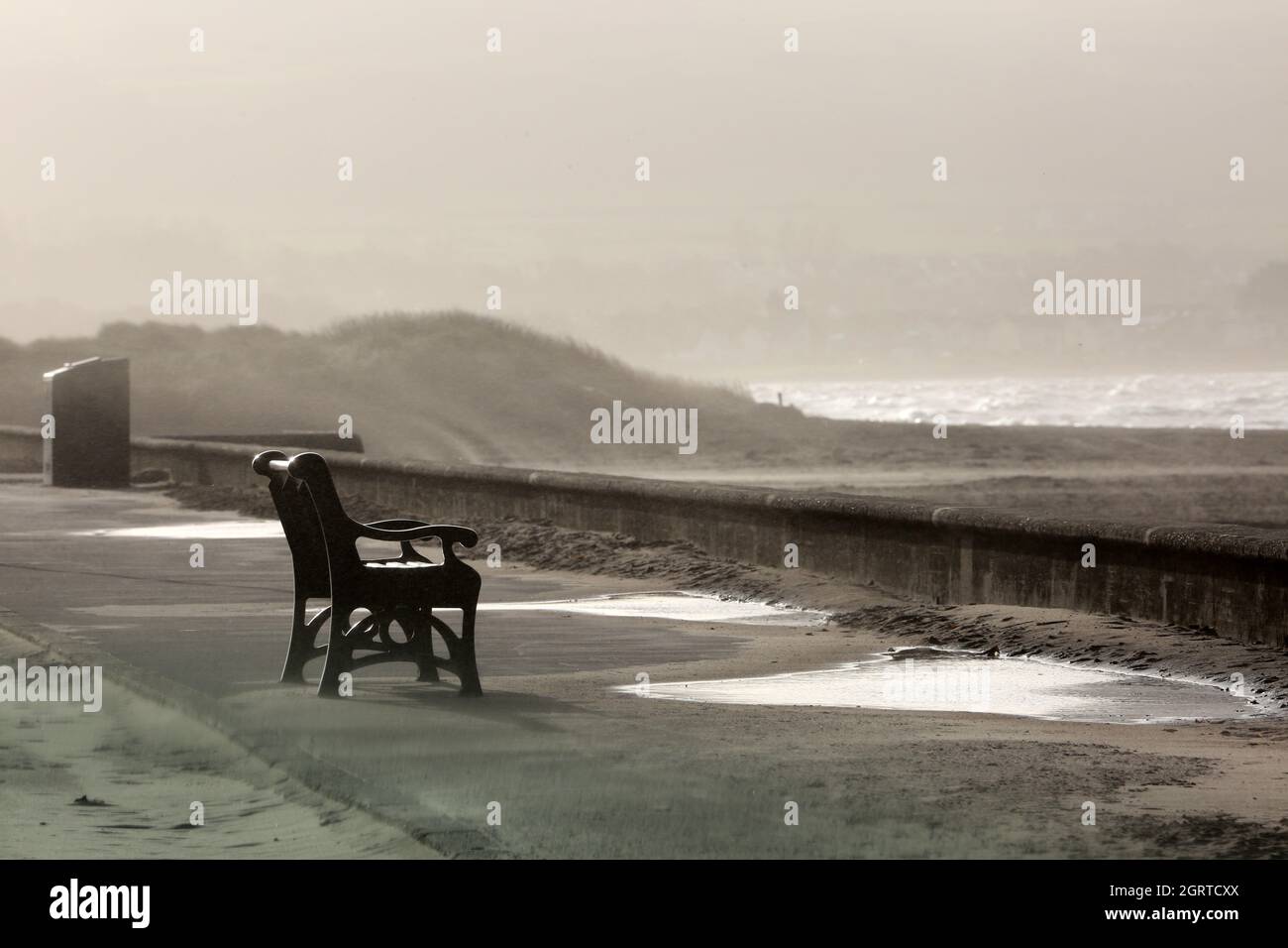Ayr, Ayrshire, Scotland, A bench sits empty waiting to be used on a ...