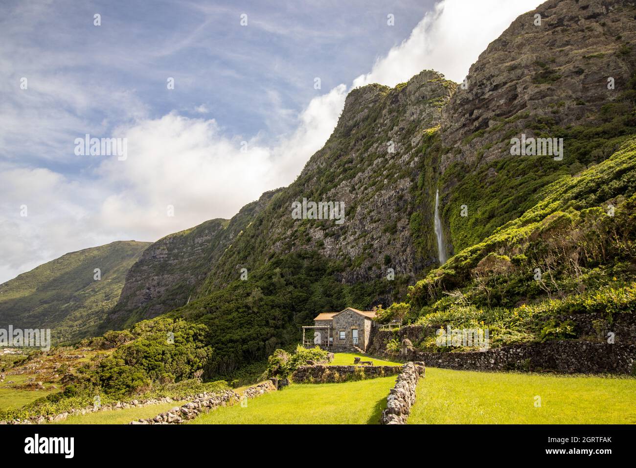 Azores islands, landscape with green vegetation and waterfall, Flores ...