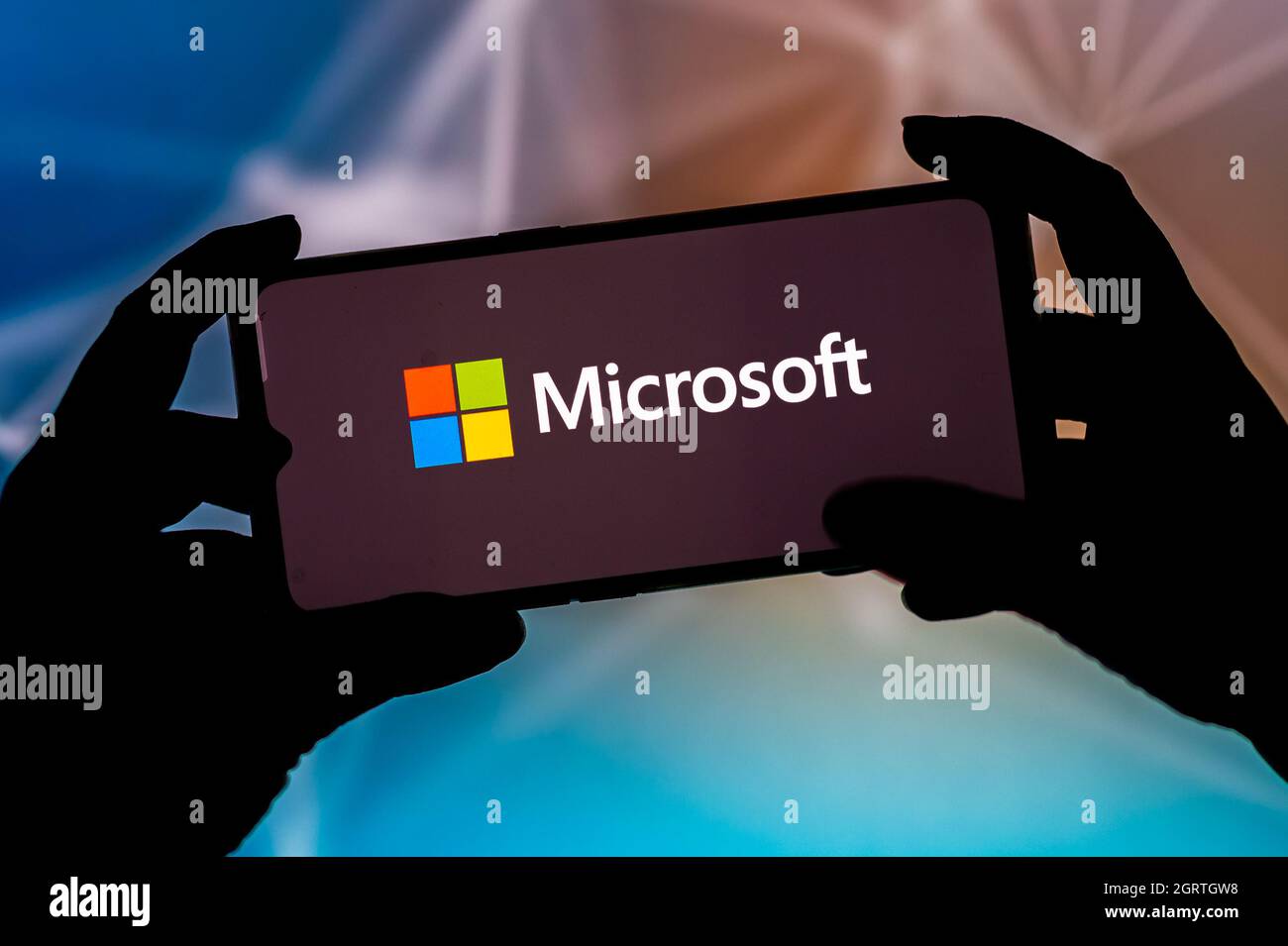In this photo illustration a Microsoft logo seen displayed on a ...