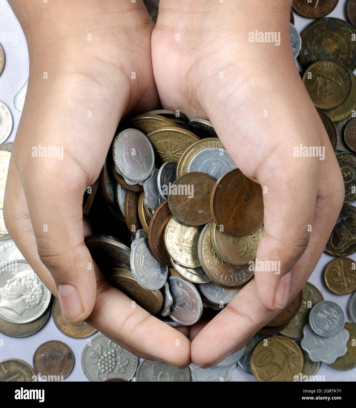 Coins in hands. The Idea of Acquiring Wealth Stock Photo - Alamy