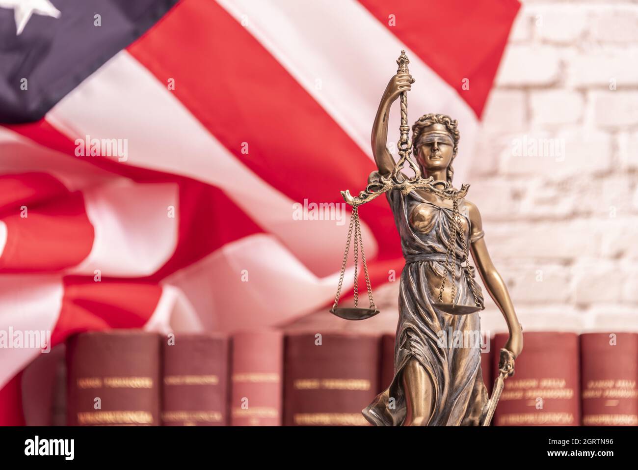 The statue of justice Themis or Iustitia, the blindfolded goddess of ...