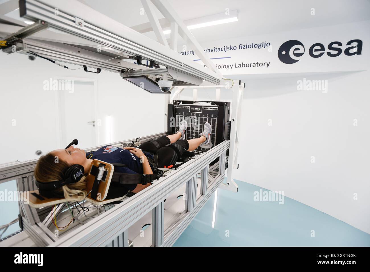 A volunteer lies in the shorthand human centrifuge as it opens at the ...