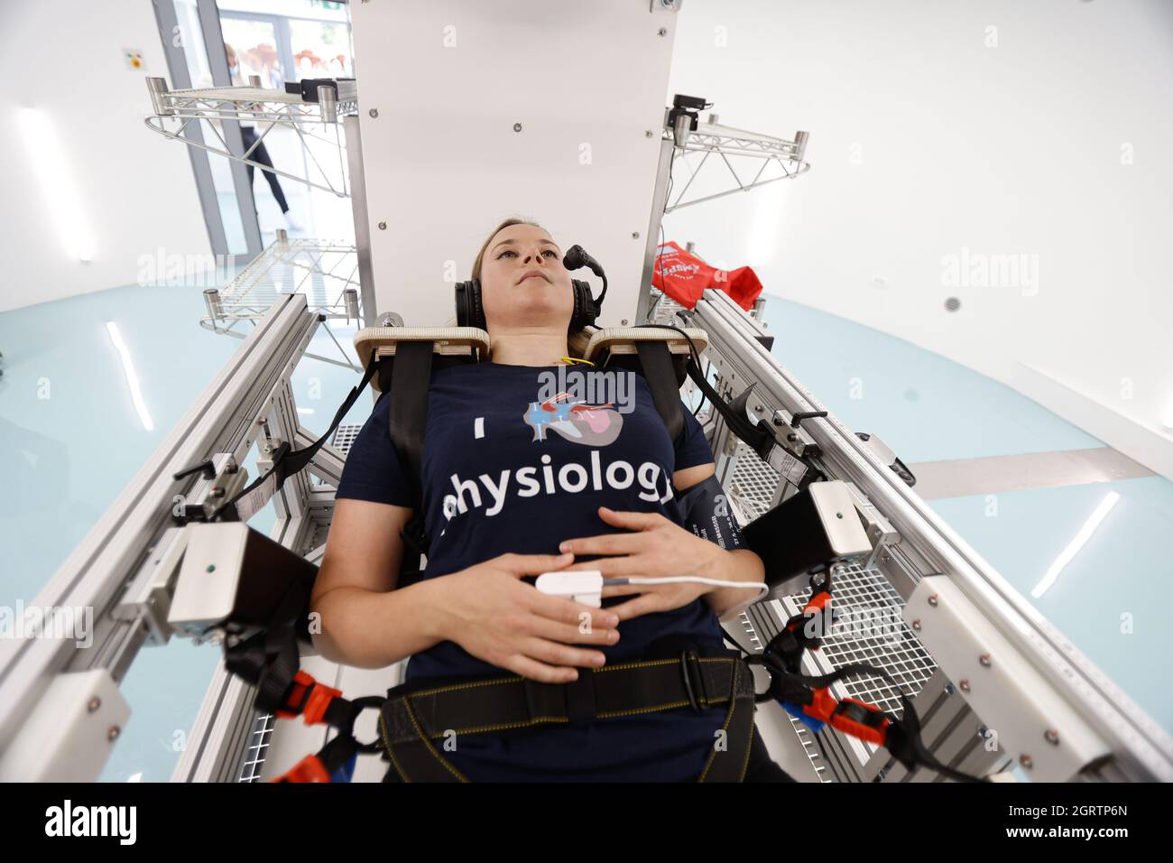 A volunteer lies in the shorthand human centrifuge as it opens at the ...