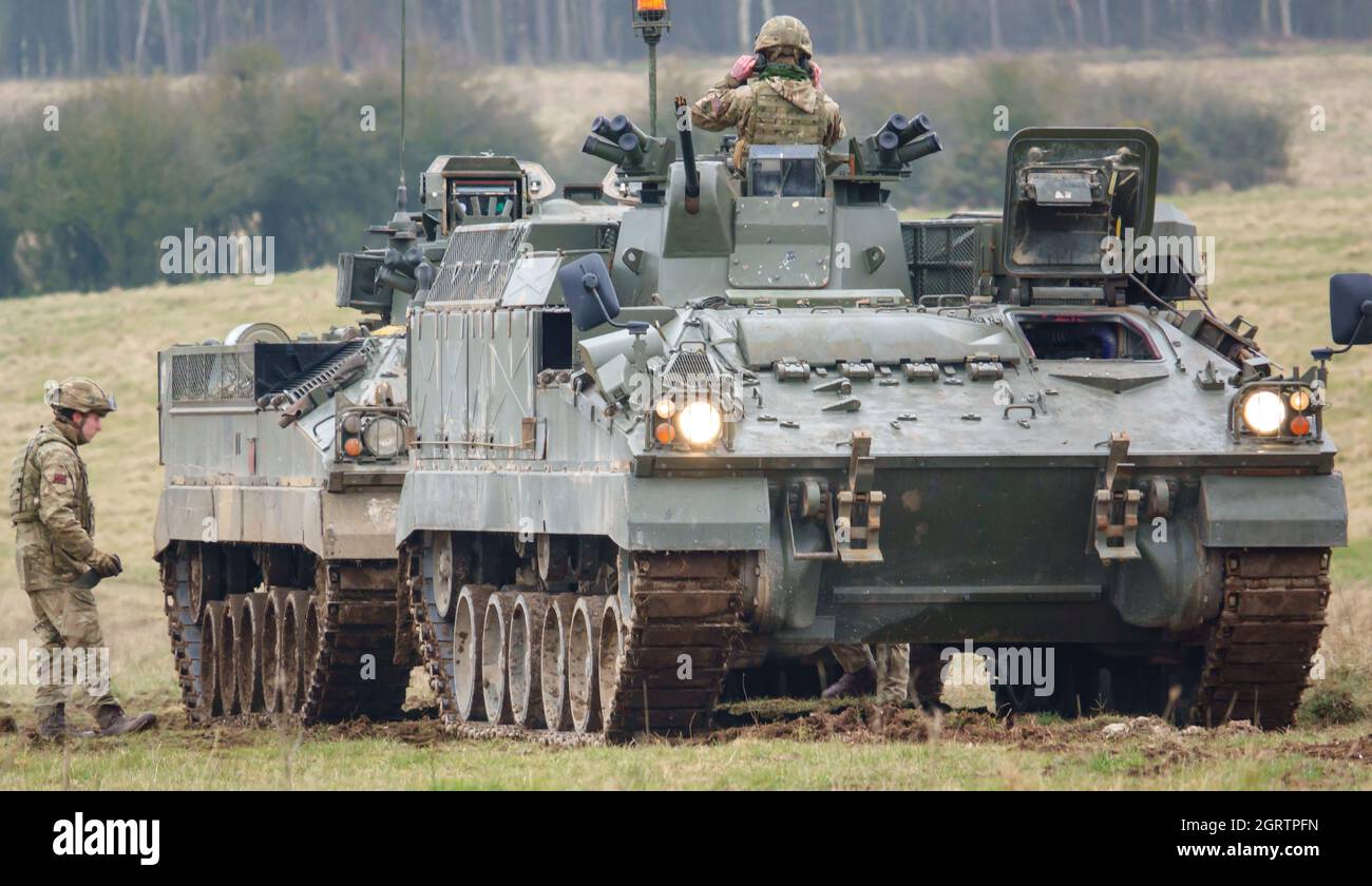 British army Warrior FV510 light infantry fighting vehicle tank being towed by a FV512 ...