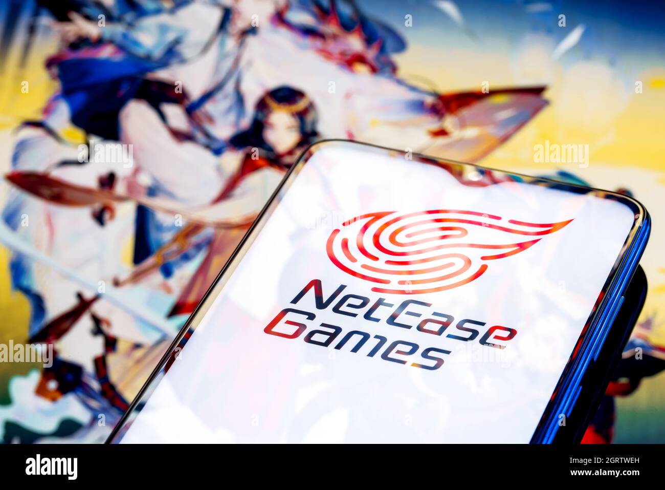 NetEase logo on smartphone screen. A frame from the Onmyoji game on the ...