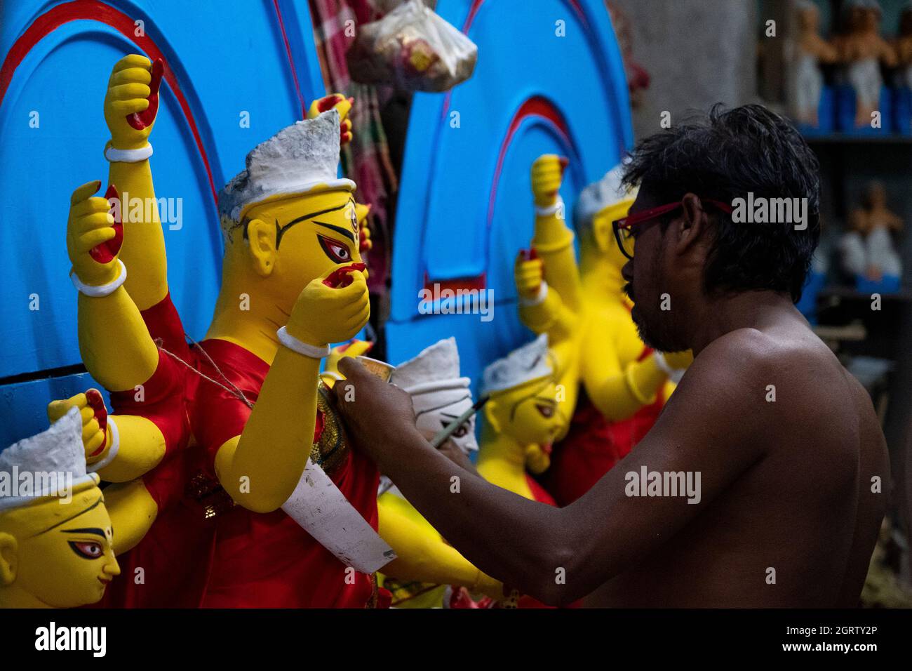 An artist making final touches to an idol at Kumartuli, the biggest ...