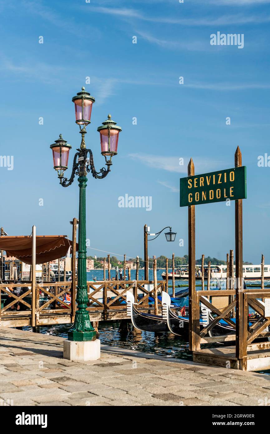 A signpost meaning "Gondola Service" along the quay near St. Mark's ...