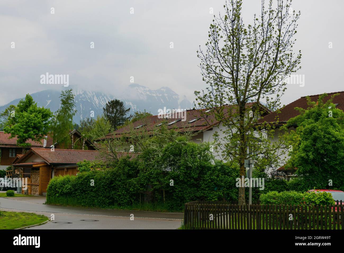 Füssen, Germany 27 May 2019 - Cozy alpine houses with wooden roofs lost ...