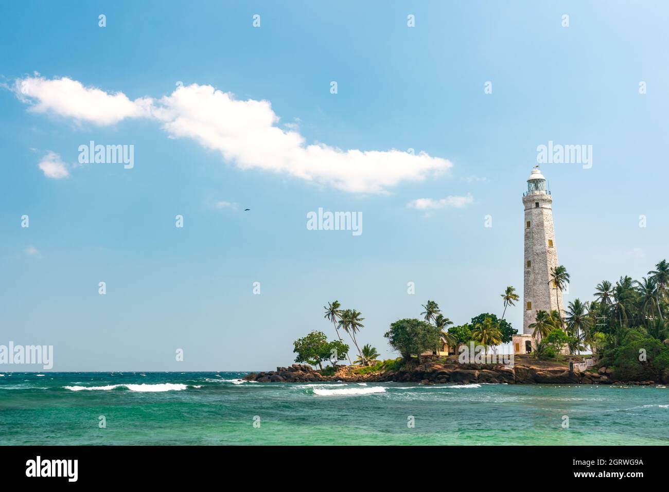 Beautiful beach and White lighthouse Dondra in Sri Lanka Stock Photo ...