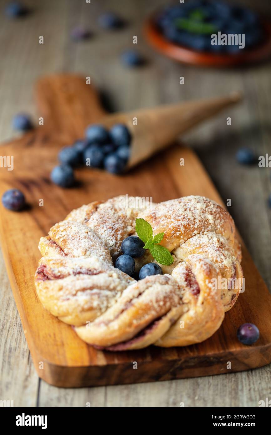 Blueberry Pleated Bun With Powdered Sugar And Fresh Berries. Vertical ...