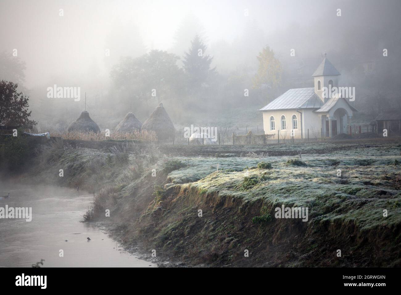 Small church in mist Stock Photo - Alamy