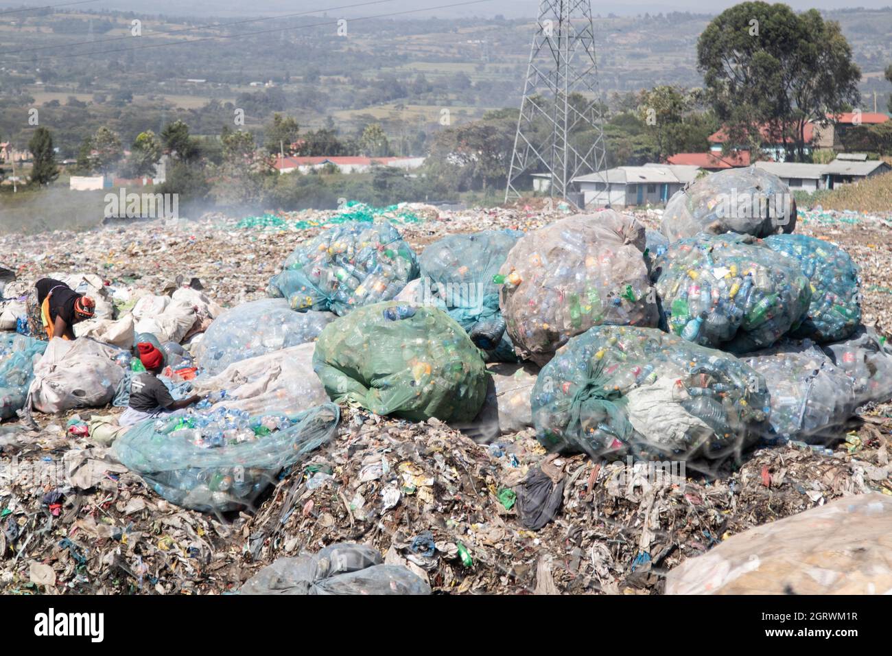 Women are seen sorting plastic bottles waste at Gioto Dumping Site to ...
