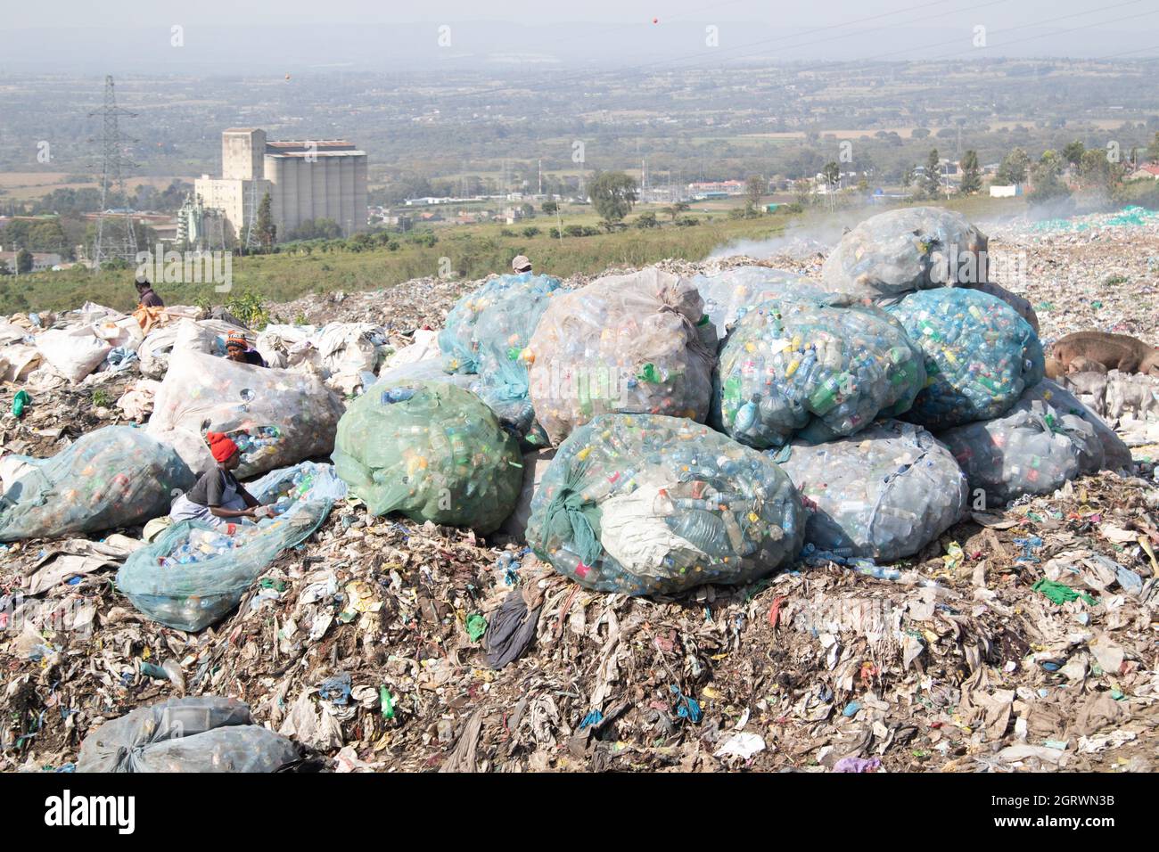 Women are seen sorting plastic bottles waste at Gioto Dumping Site to ...