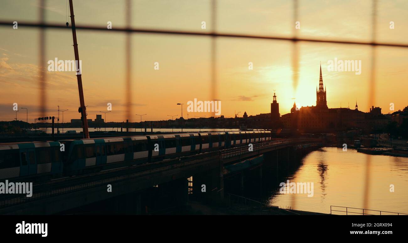 Stockholm, Sweden. Sunset Sun Shine Through Dark Silhouette Of ...